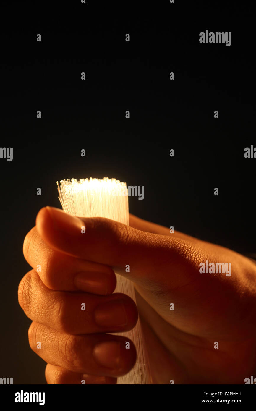 hand holding bundlle of fiber optic Stock Photo - Alamy