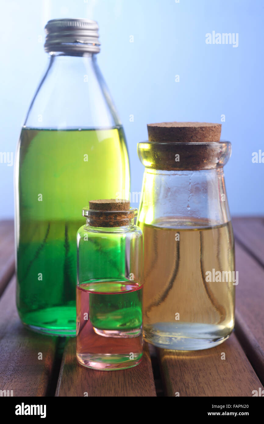 few bottles on top of brown table Stock Photo - Alamy