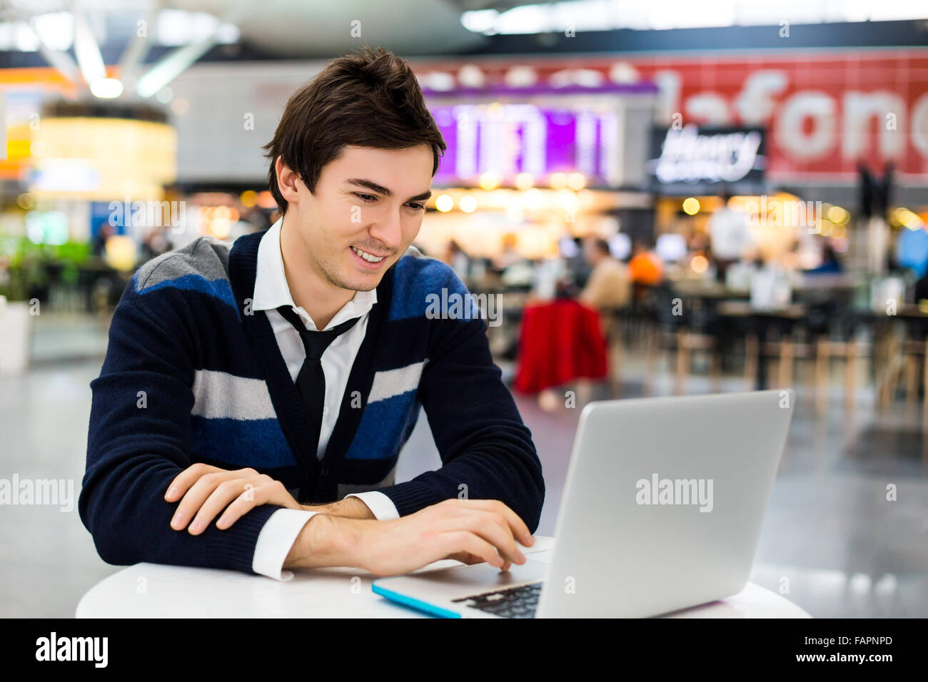 Happy young business man work on computer Stock Photo - Alamy