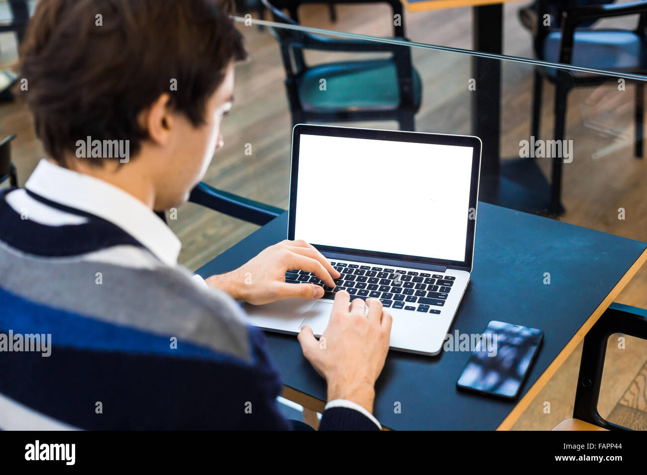 Closeup portrait freelance man using his laptop Stock Photo - Alamy
