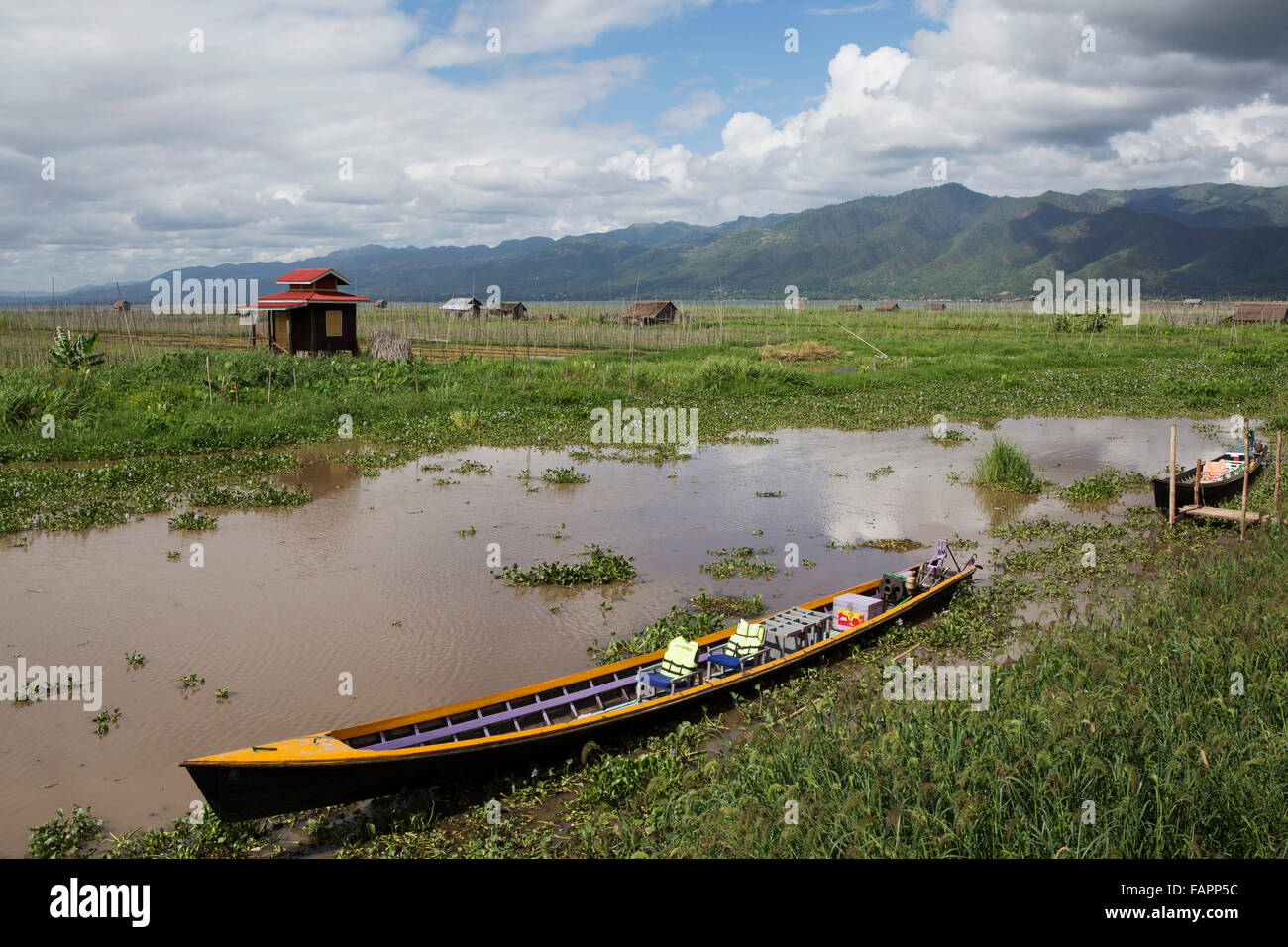 A tour boat moored by Inle Lake in Myanmar (Burma Stock Photo - Alamy