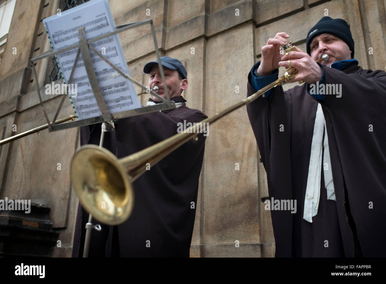 Two musicians churchmen and toned dresses with long trumpets melodies ...