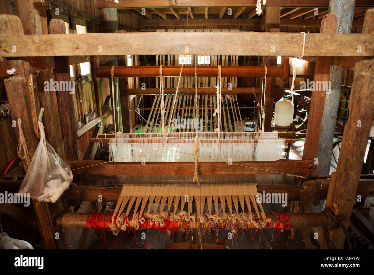 A loom in a lotus and silk weaving workshop on Inle Lake in Myanmar ...
