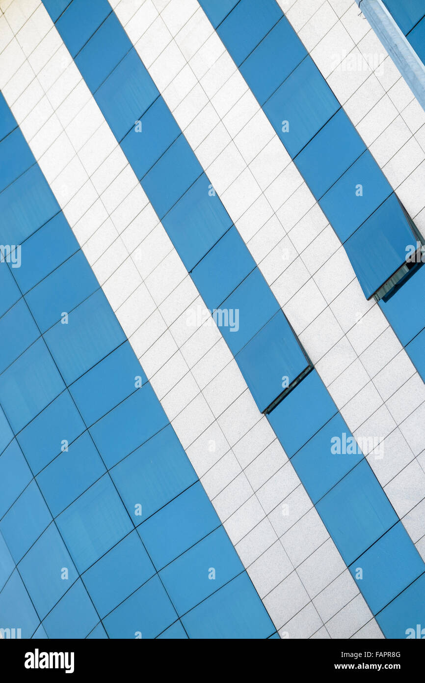 diagonal lines on a vertical view of a facade with blue windows Stock ...
