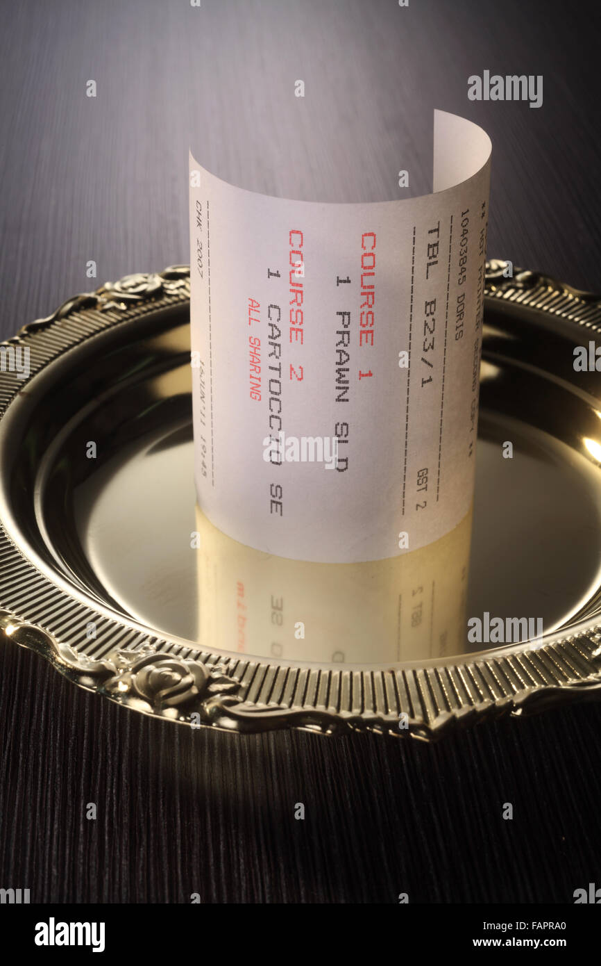 stock image of the curly recipt on the golden plate Stock Photo - Alamy