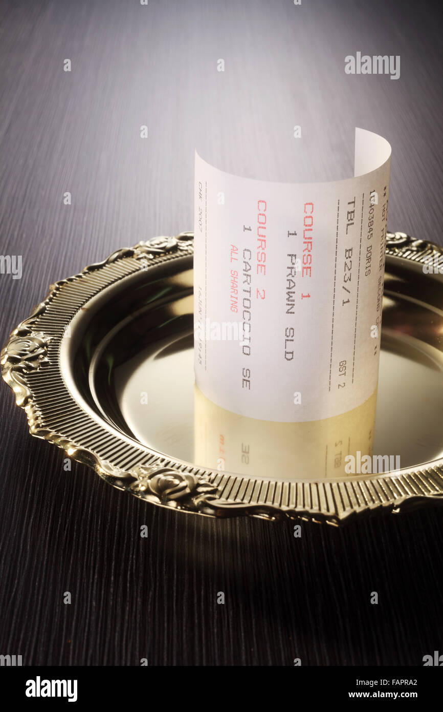 stock image of the curly recipt on the golden plate Stock Photo - Alamy