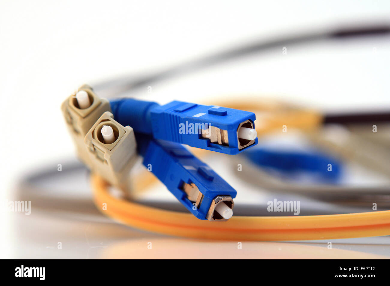 Fiber optical patch cord with plugs isolated on white background Stock ...