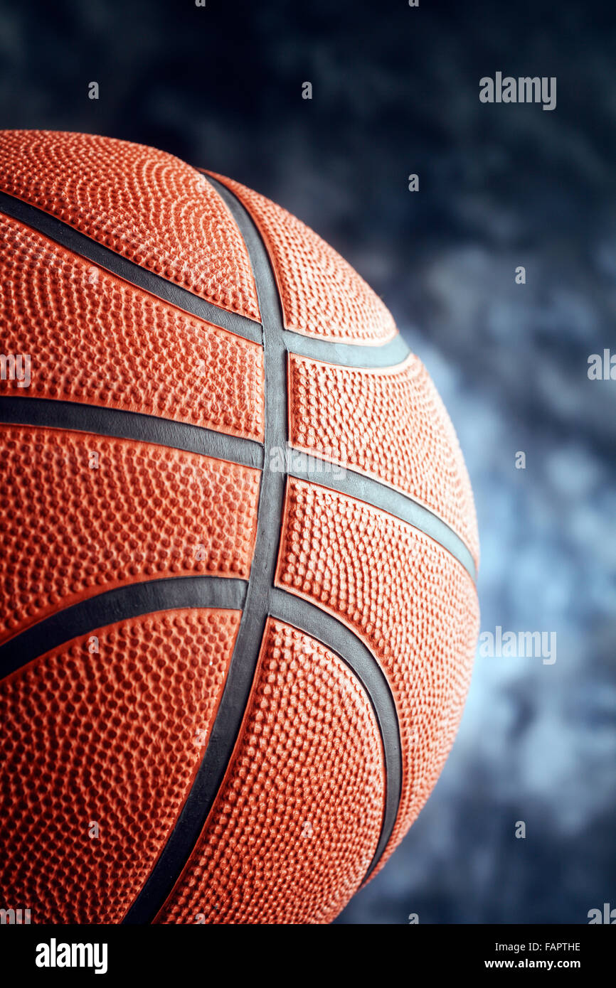 Basketball isolated on the blue background Stock Photo - Alamy