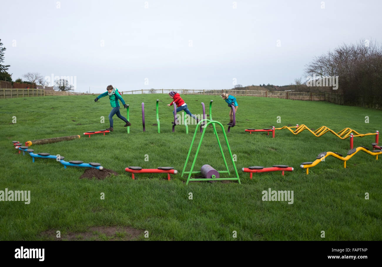 Family playing on a playground in the UK Stock Photo - Alamy