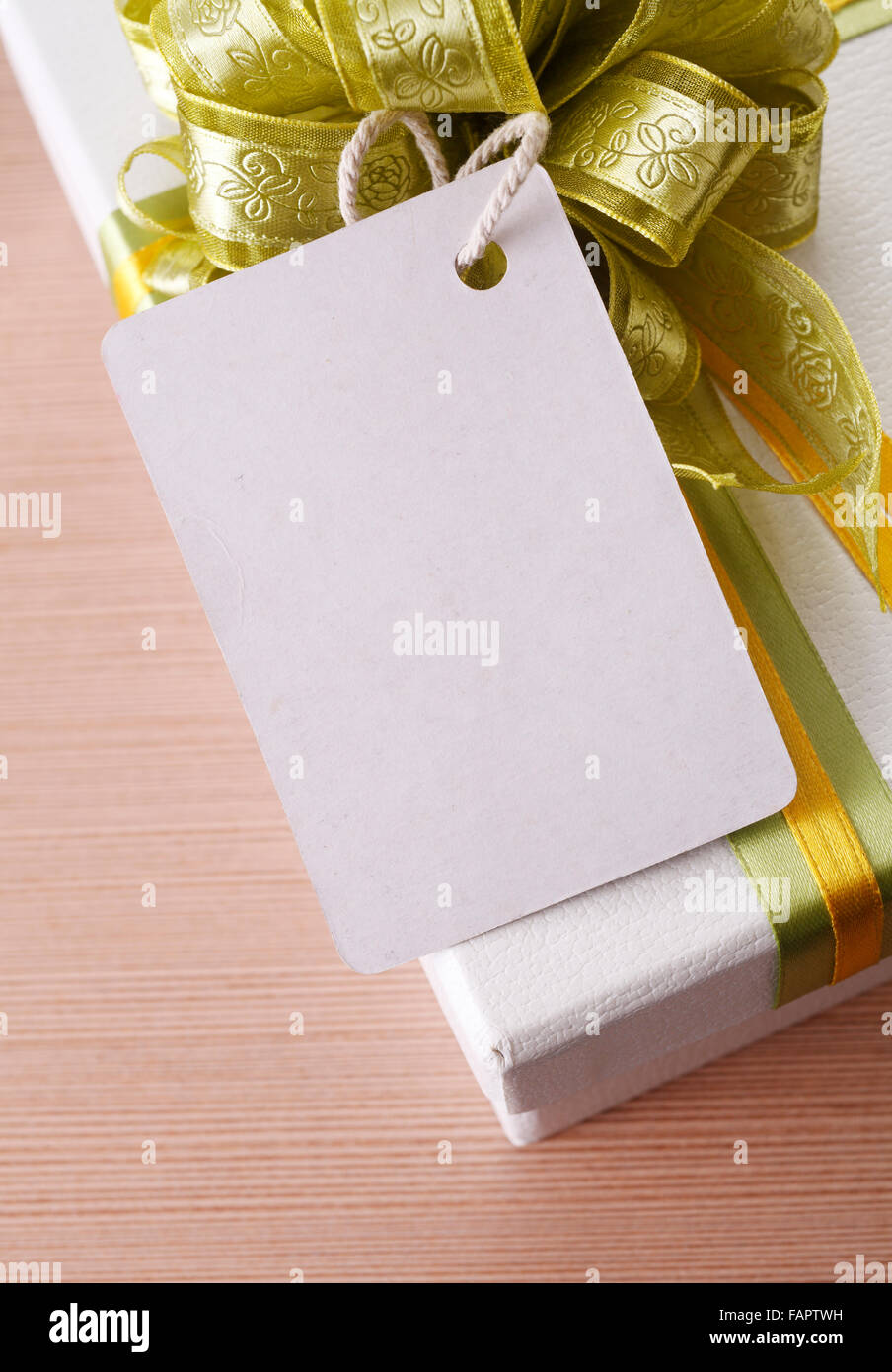 Present on the wooden table Stock Photo - Alamy