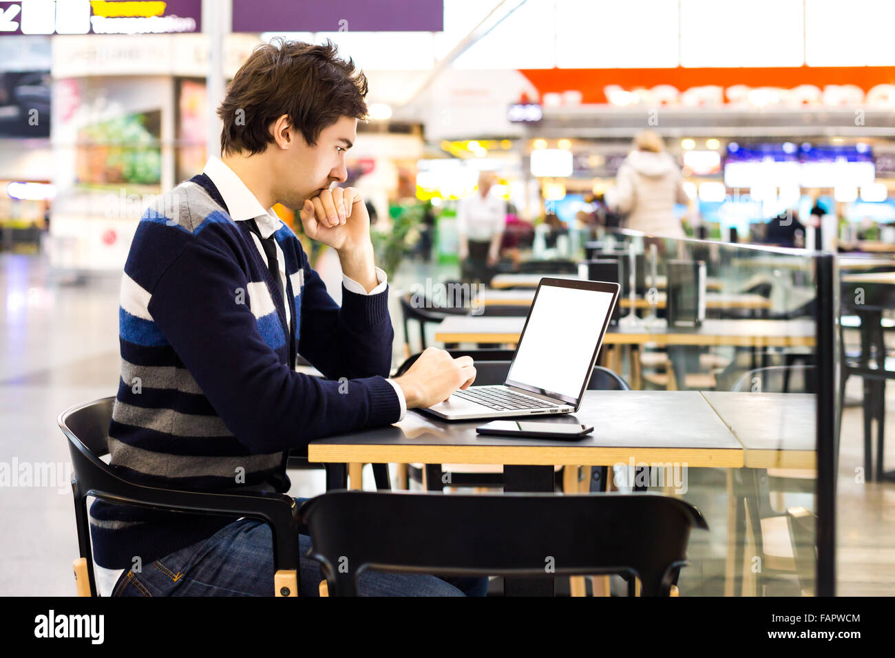 Business man connecting to wireless on his laptop Stock Photo - Alamy