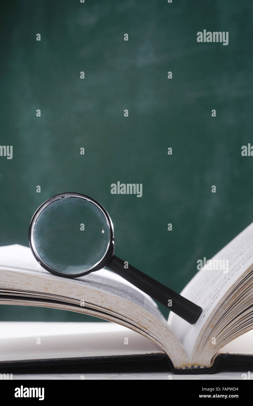 Open book magnifier hi-res stock photography and images - Alamy