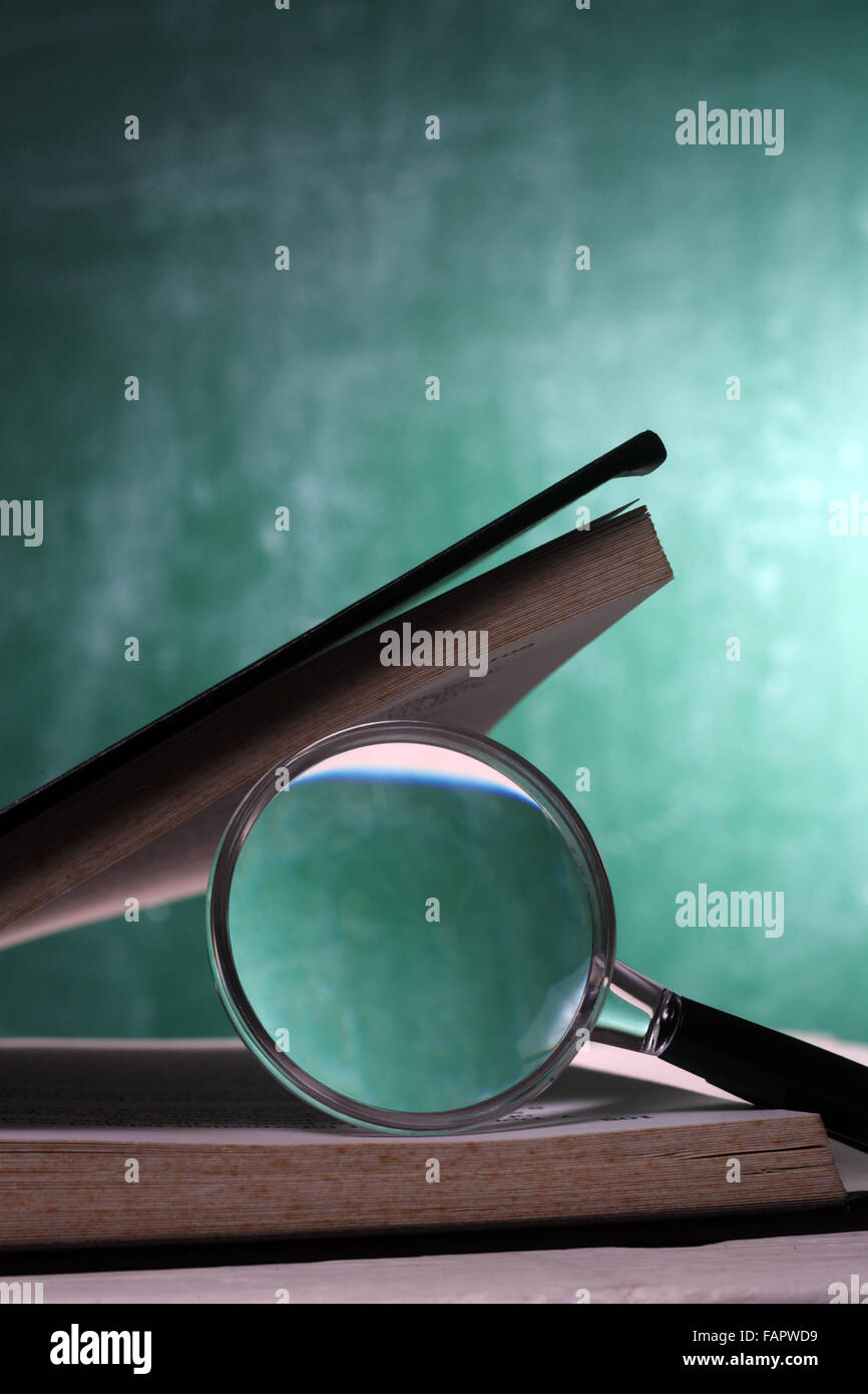 Open book magnifier hi-res stock photography and images - Alamy