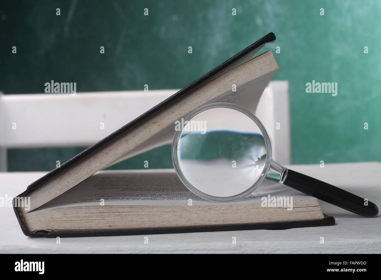 Open book magnifier hi-res stock photography and images - Alamy