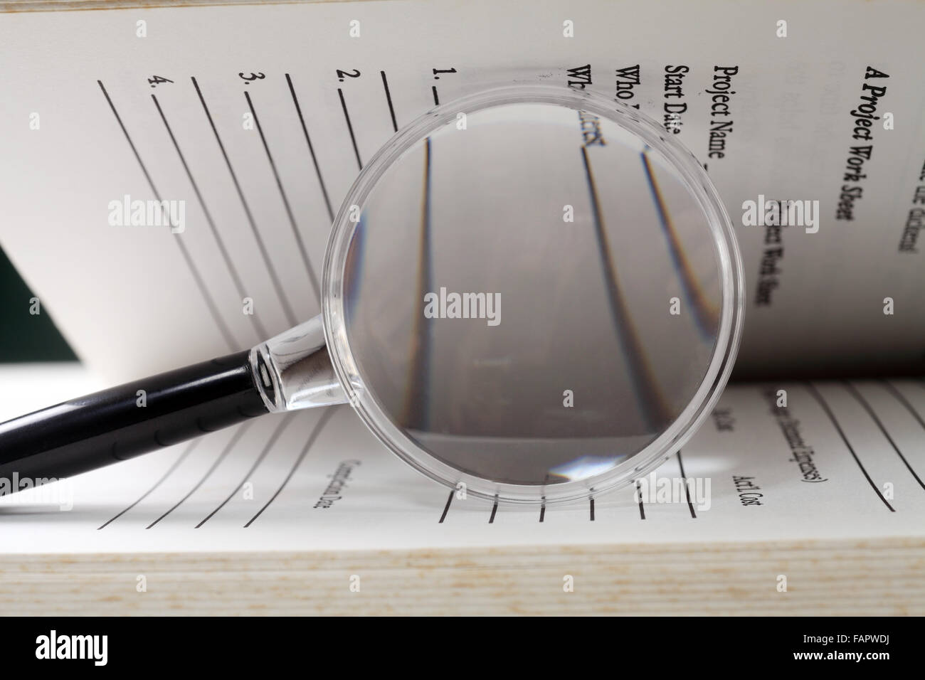 Open book magnifier hi-res stock photography and images - Alamy
