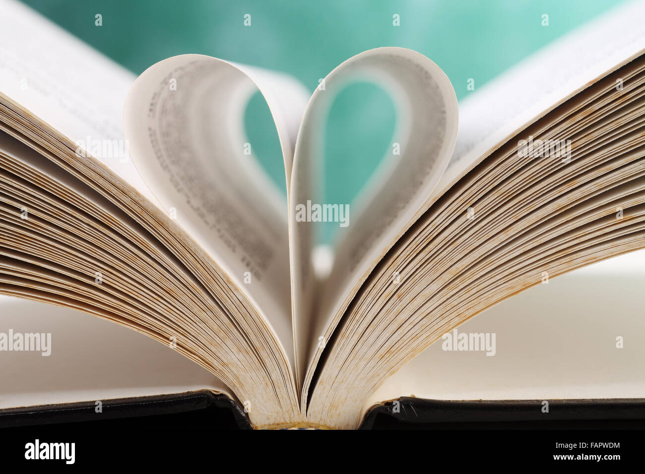 heart shape folded from the centre page Stock Photo - Alamy