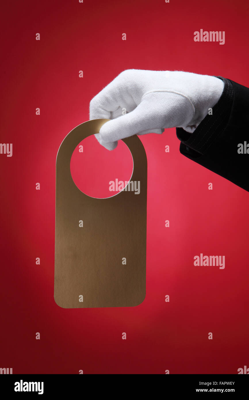 close up of the hotel staff holding a door sign Stock Photo - Alamy