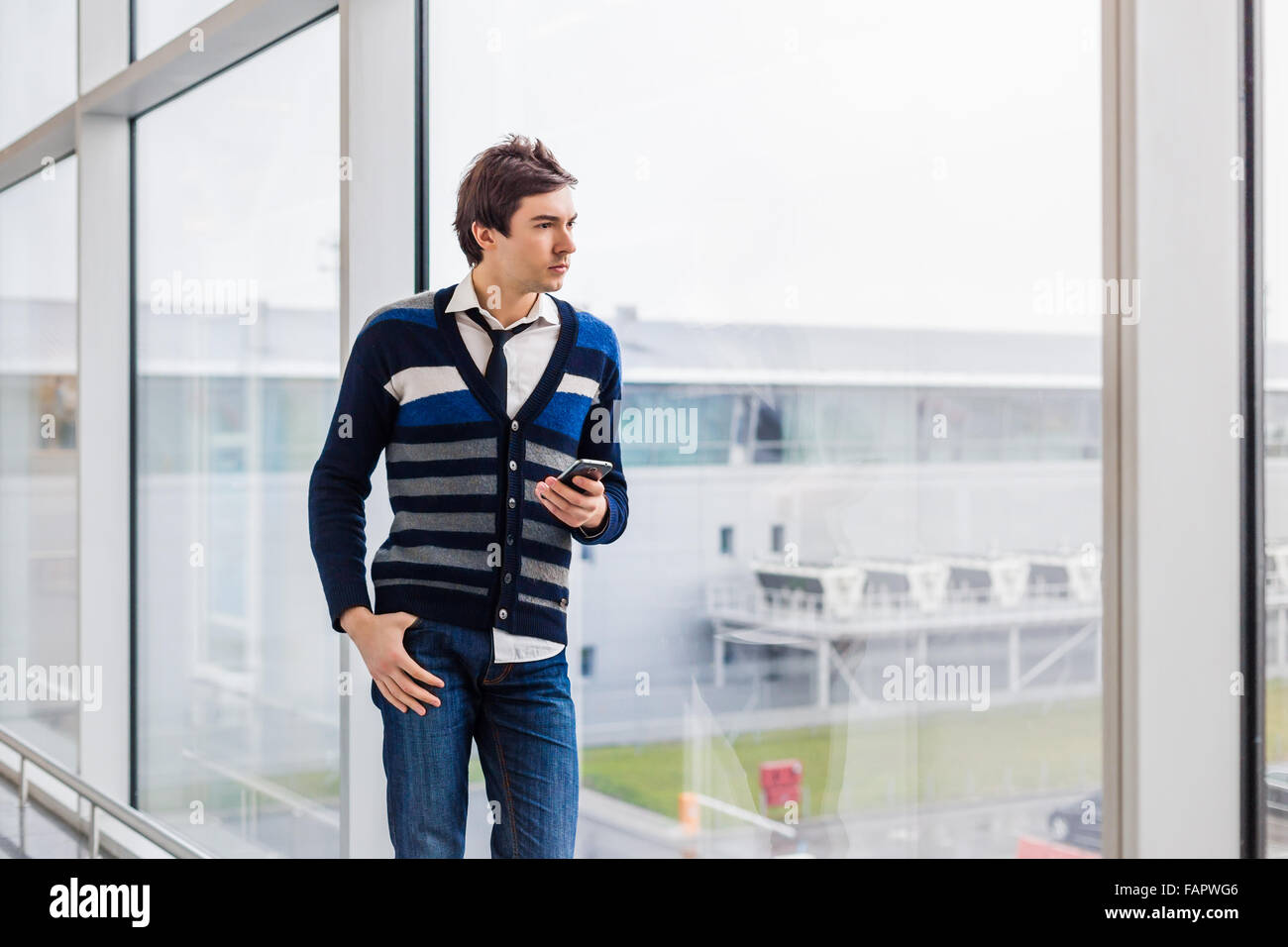 Freelancer man standing window hi-res stock photography and images - Alamy