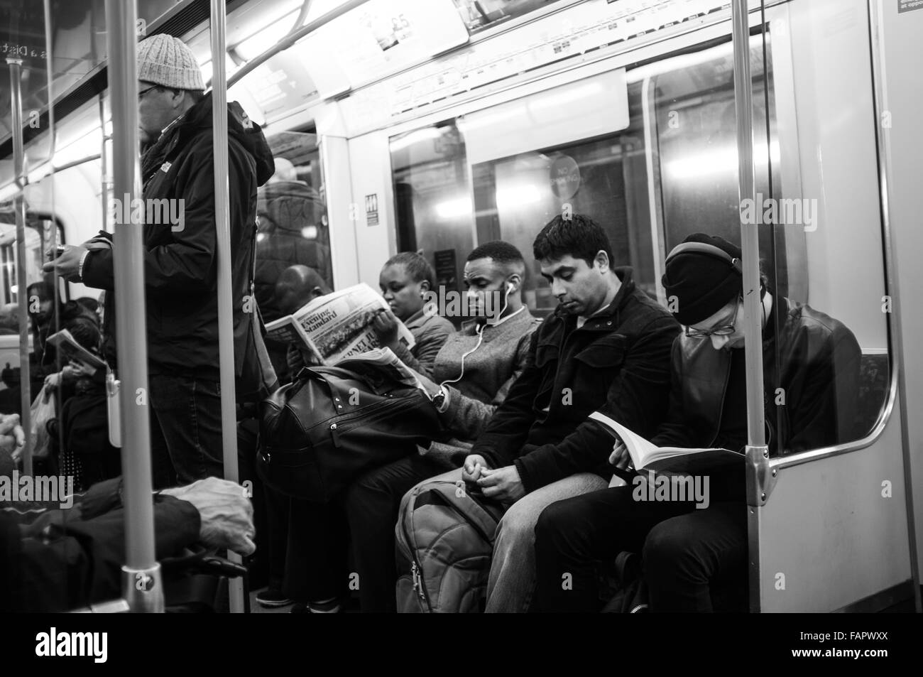Passengers on London Underground District Line train Stock Photo - Alamy