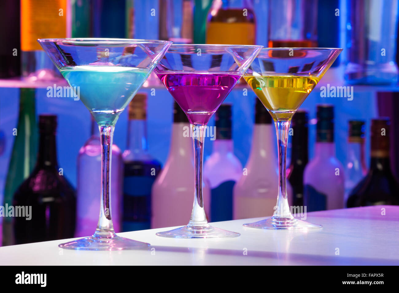 Set of color cocktail martini glasses in the bar Stock Photo - Alamy