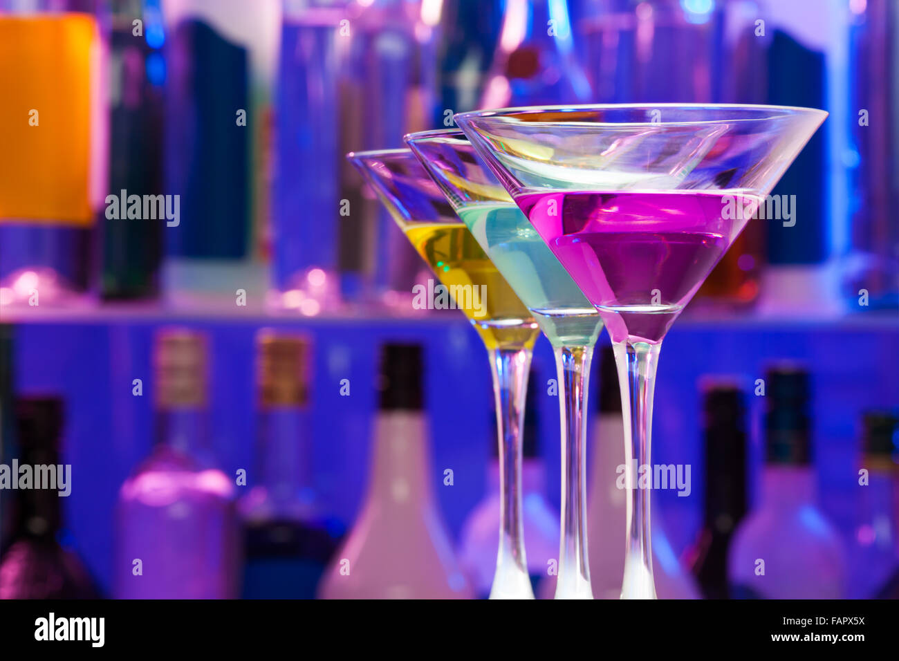 Close up of three color alcohol cocktails in bar Stock Photo - Alamy