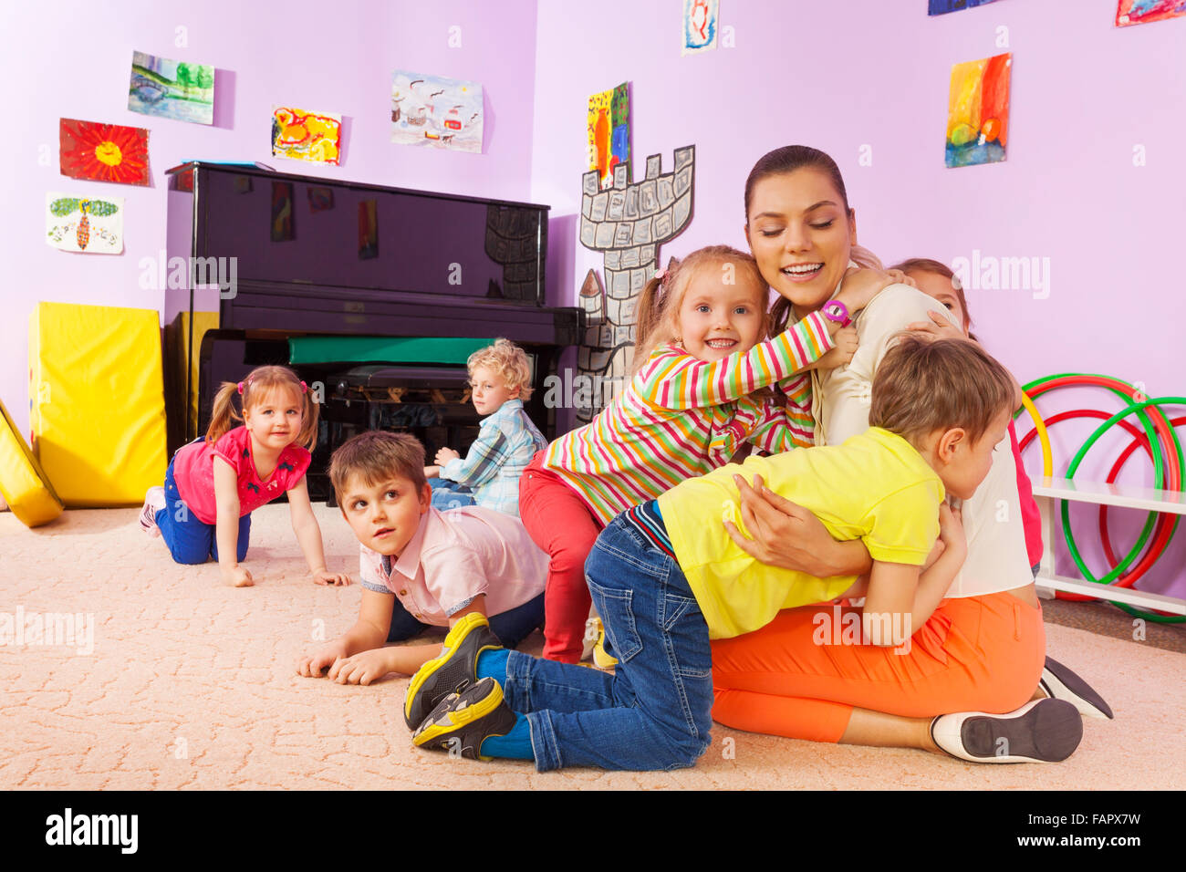 Preschool teacher child hugging hi-res stock photography and images - Alamy