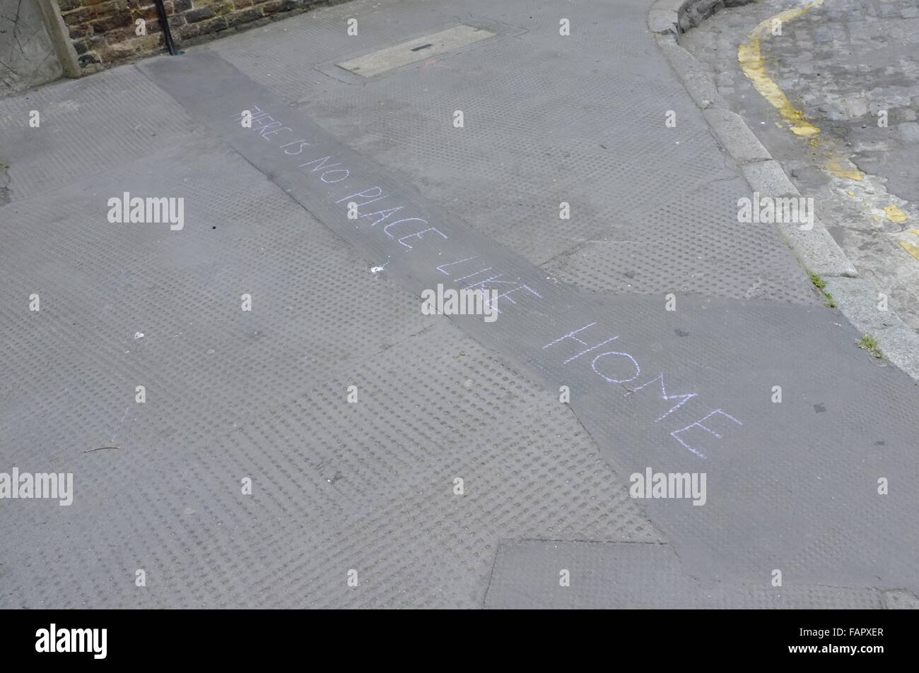 'There's No Place Like Home' written on London pavement in purple chalk ...