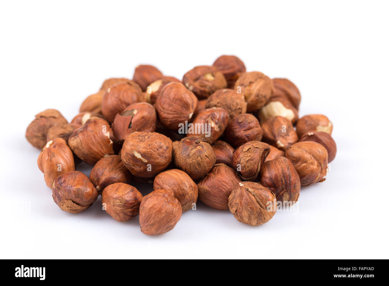 Heap of hazelnuts isolated on white background, macro image Stock Photo ...