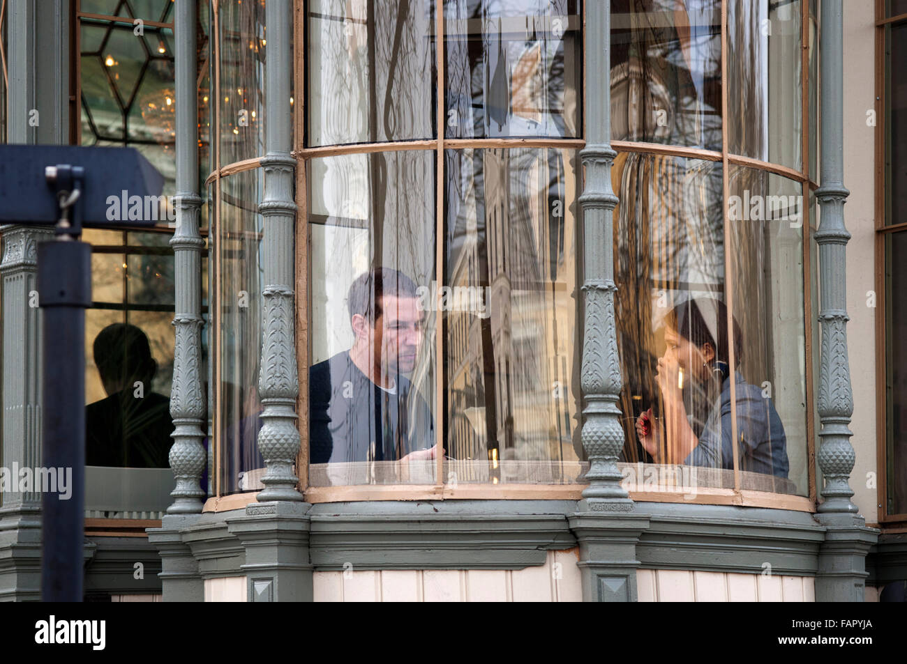 Inside Havis Amanda restaurant, Helsinki, Finland. A couple eating at ...