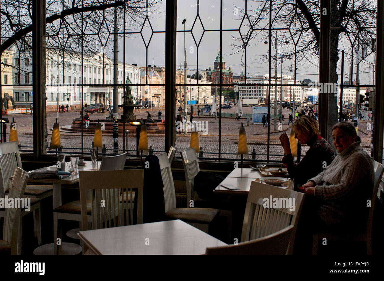 Inside Havis Amanda restaurant, Helsinki, Finland. A couple eating at ...