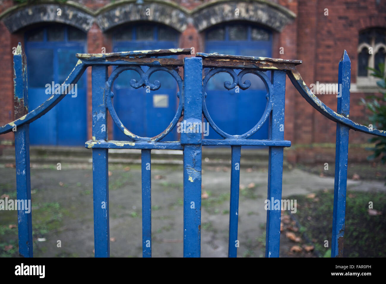 Detail of bright blue painted rusty gates Stock Photo - Alamy