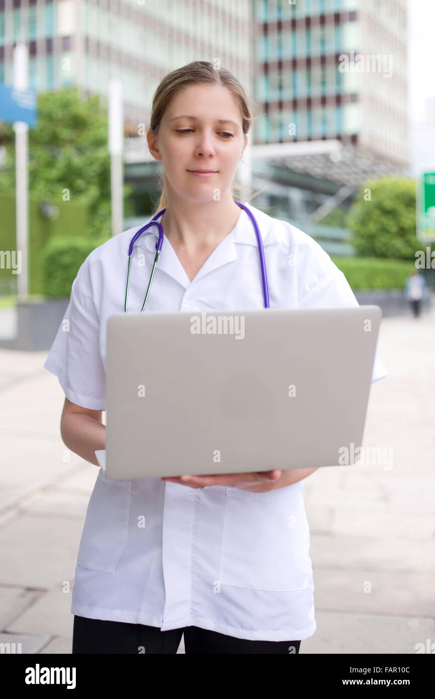 young doctor using a laptop computer Stock Photo - Alamy