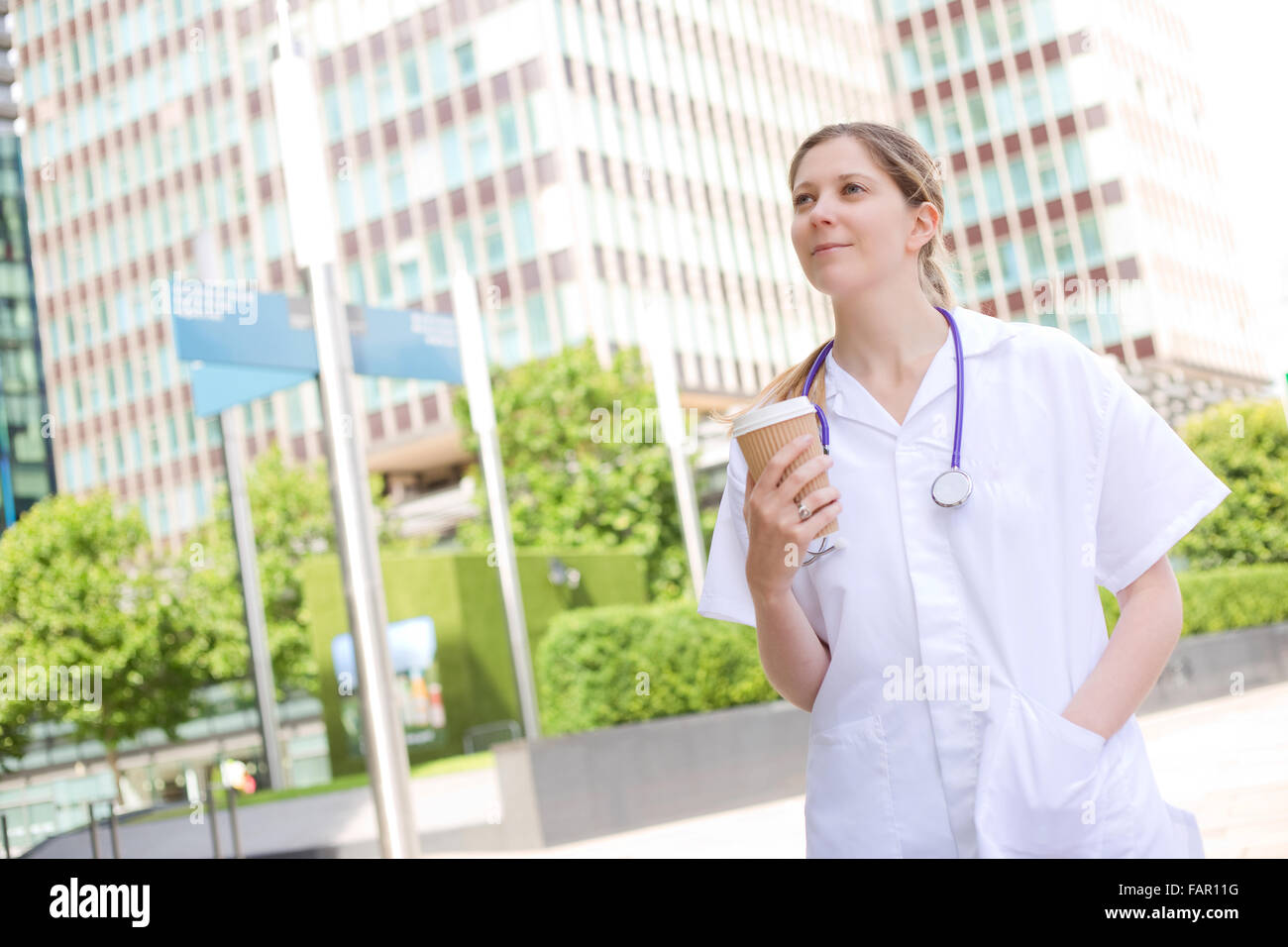 young doctor having a coffee before work Stock Photo - Alamy