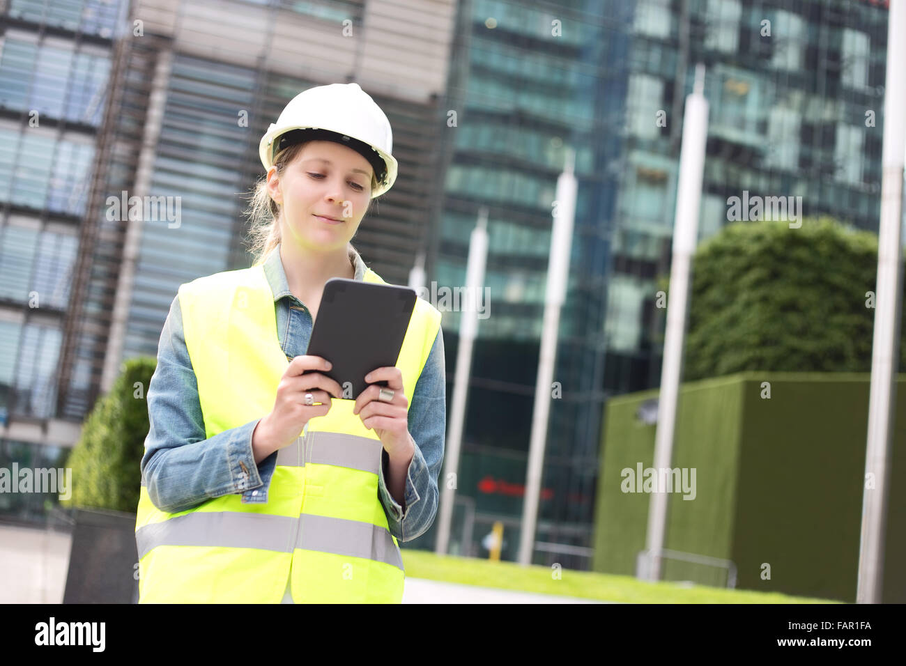 construction worker holding a tablet Stock Photo - Alamy