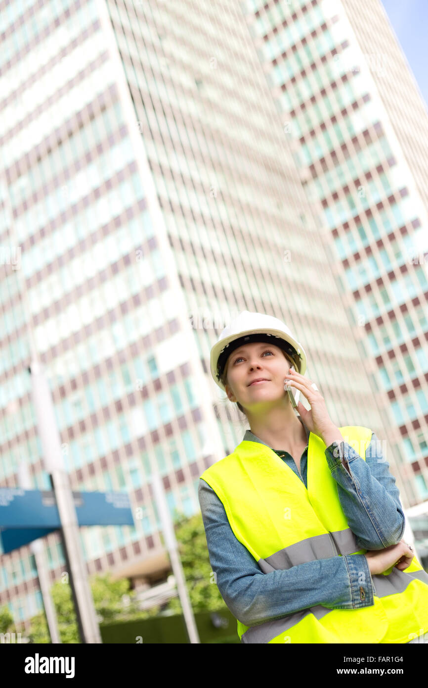 Builder smartphone on construction site hi-res stock photography and ...