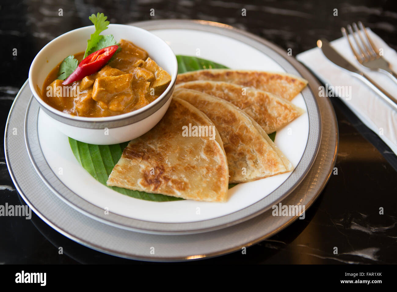 Chicken curry served with paratha in Yangon, Myanmar (Burma Stock Photo ...