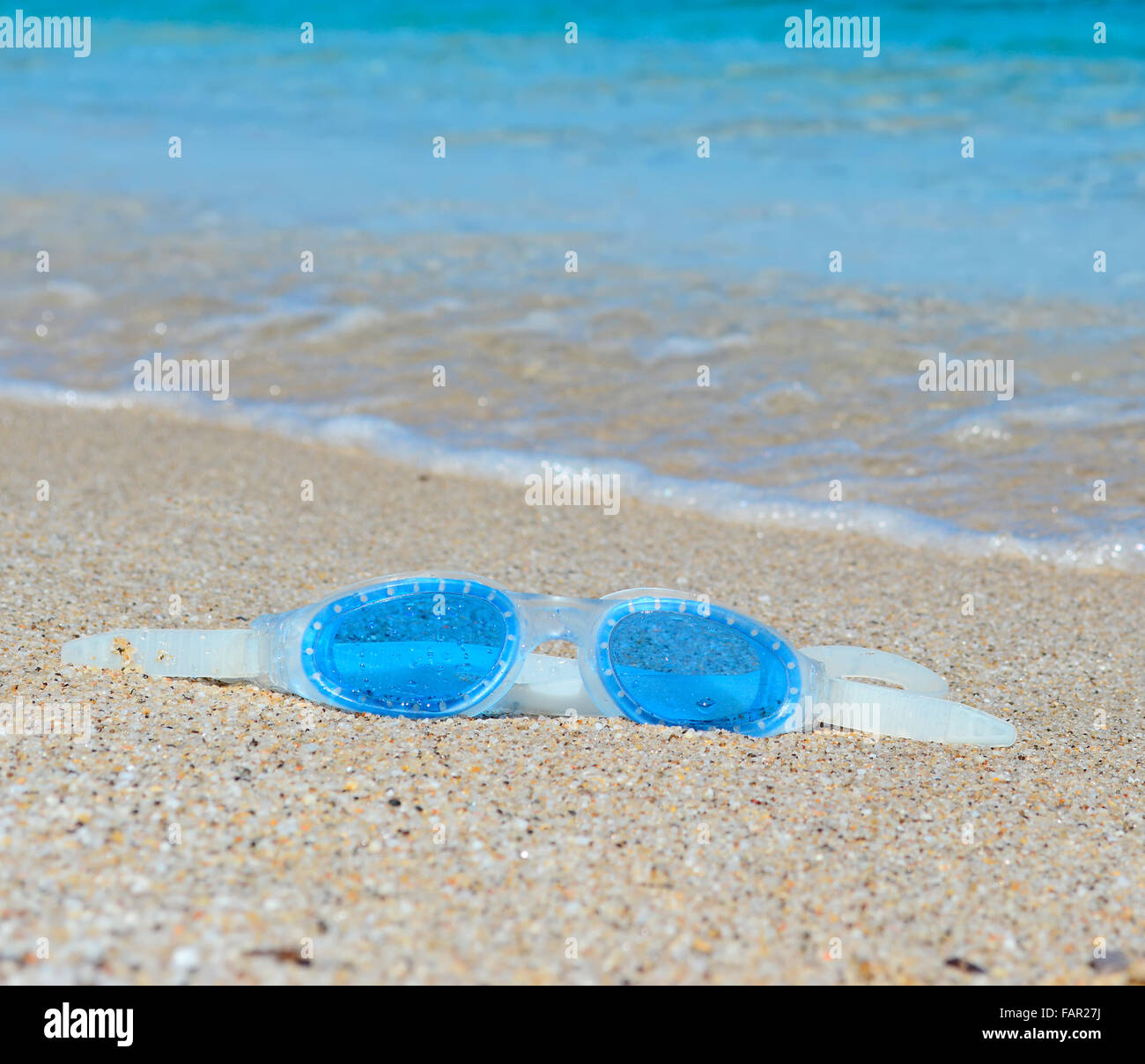 blue sea goggles on a tropical beach Stock Photo - Alamy
