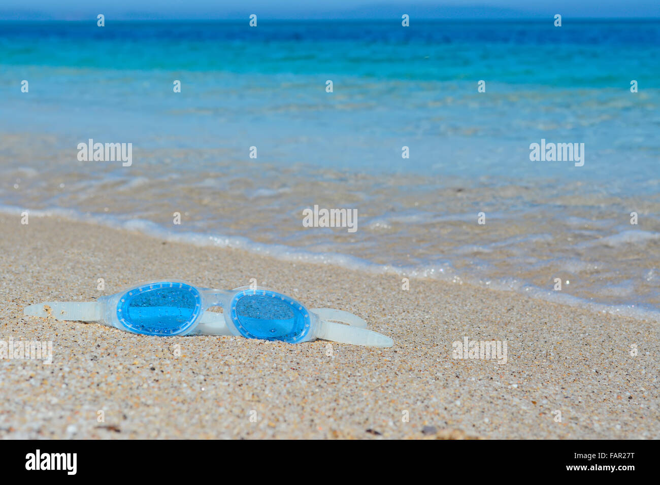 blue sea goggles on a tropical beach Stock Photo - Alamy