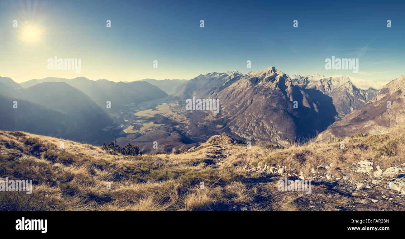 Mountain slope rising above a valley Stock Photo - Alamy