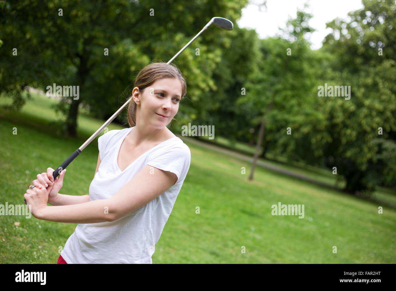 Female golfer driving golf ball hi-res stock photography and images - Alamy