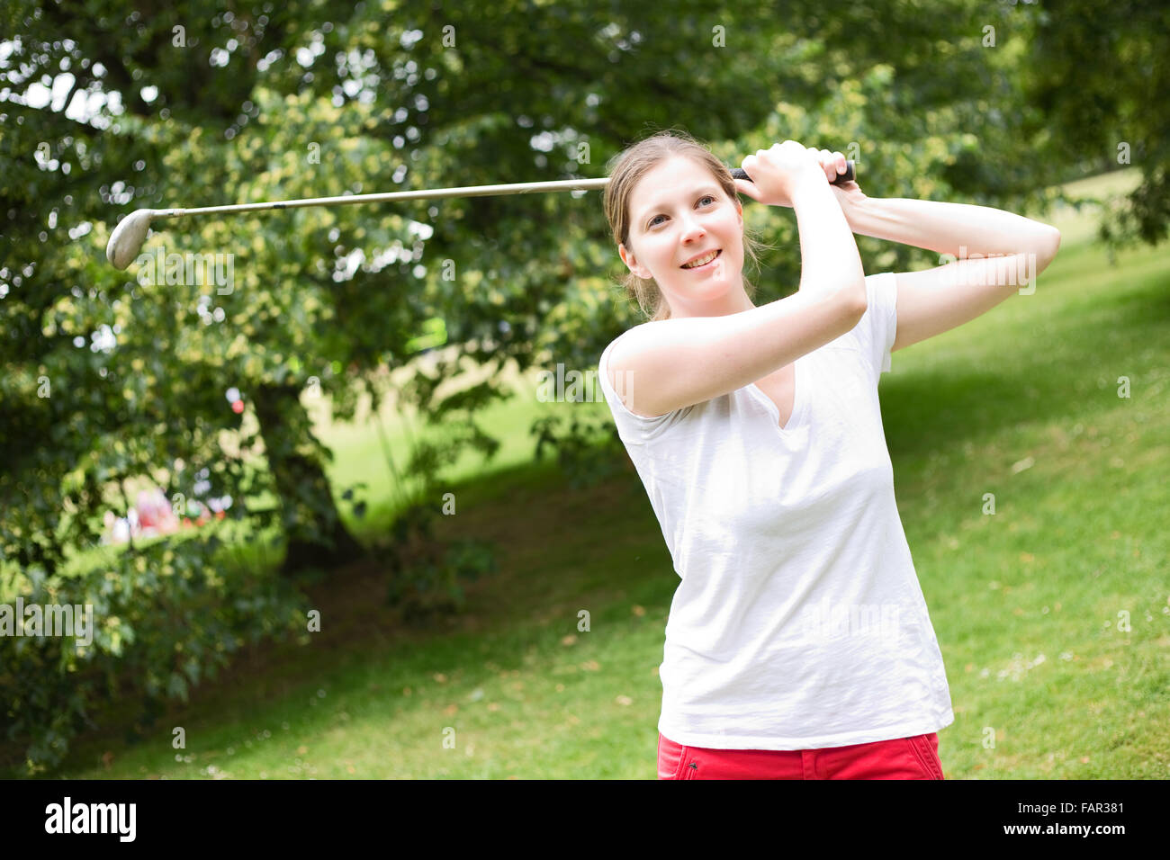 Female golfer driving golf ball hi-res stock photography and images - Alamy
