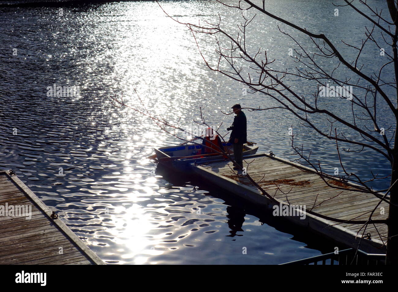 Two men talking at a dock in Ontario Stock Photo - Alamy