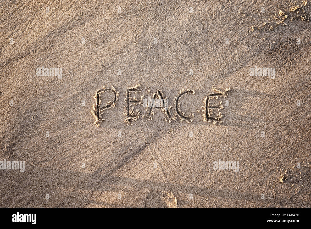 Word peace written in sand hi-res stock photography and images - Alamy