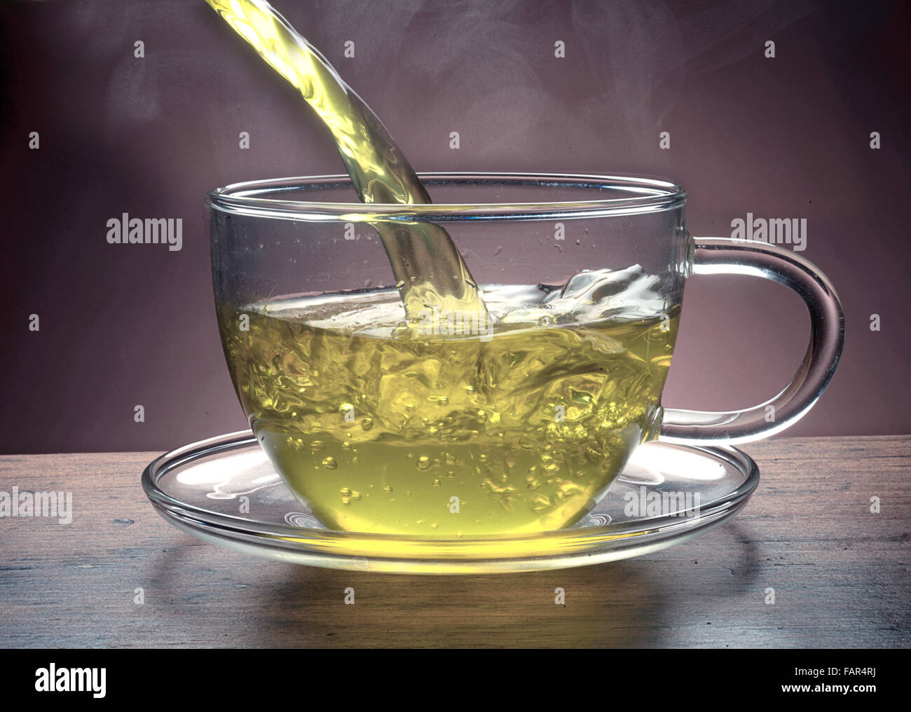 Tea pouring into cup hi-res stock photography and images - Alamy