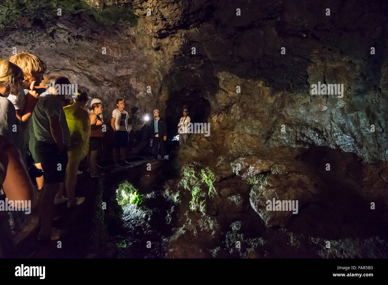 Madeira - Grutas de Sao Vicente. Group of visitors in the caves Stock ...