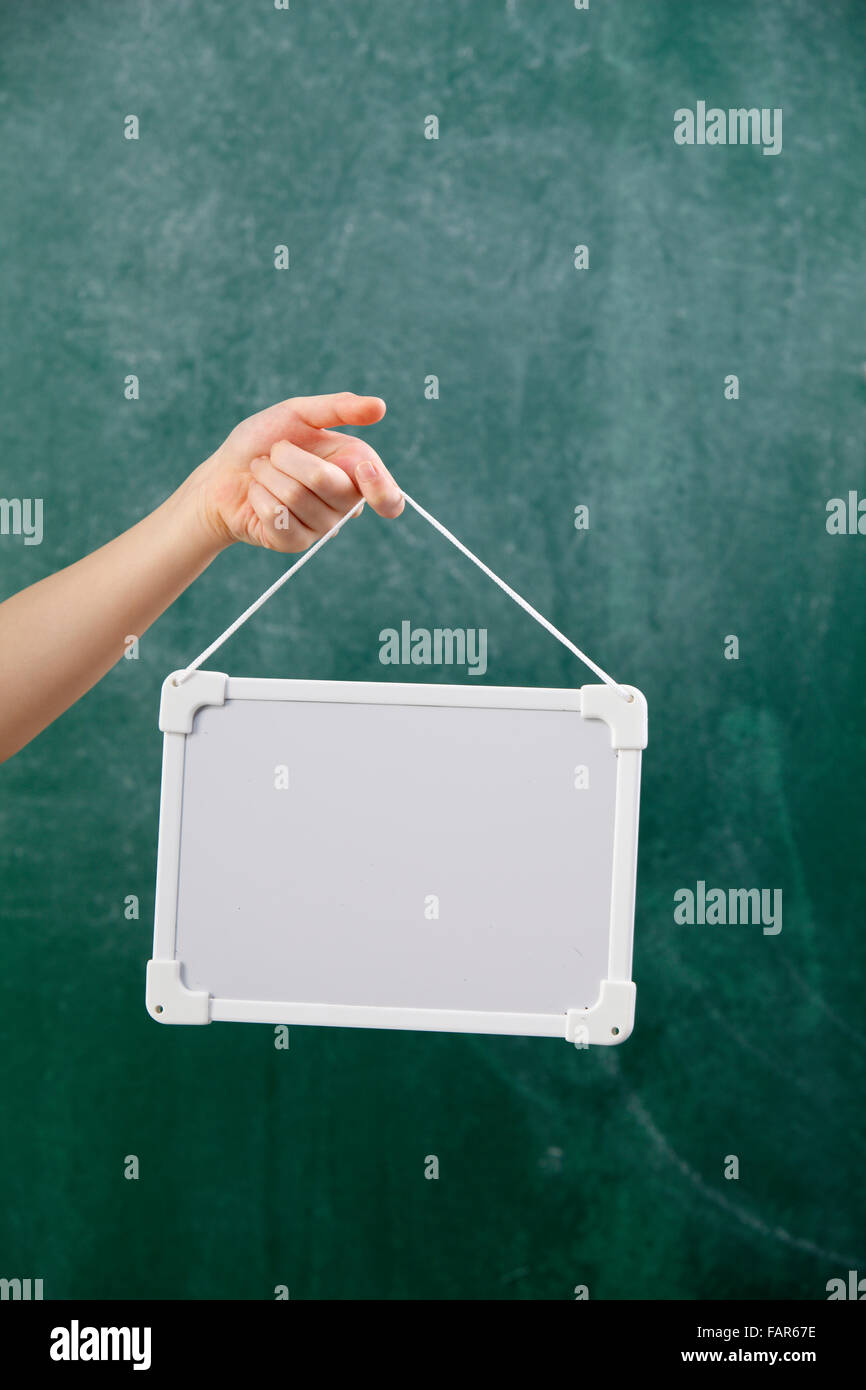 stock image of the hand holding white board Stock Photo - Alamy