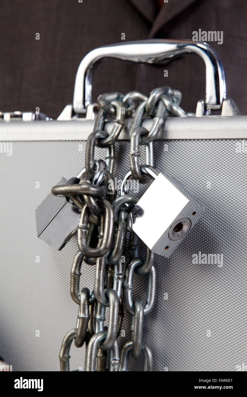 man holding the brief case with extra lock Stock Photo - Alamy