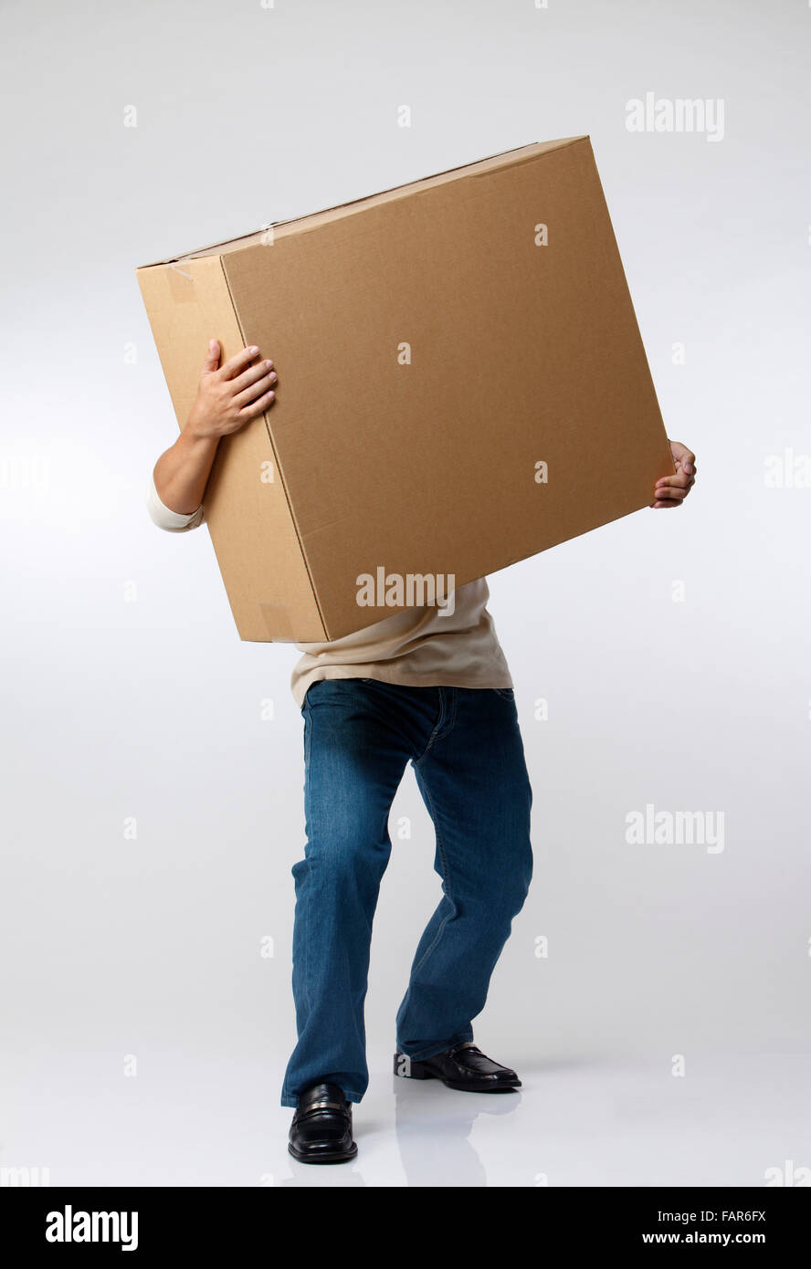 stock image of the man carrying paper box Stock Photo - Alamy