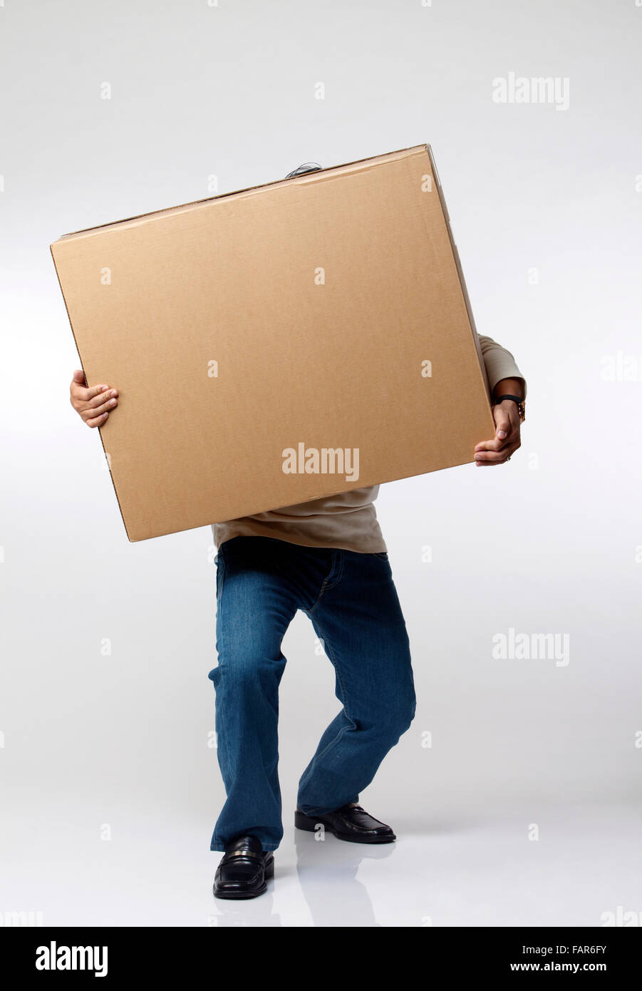 stock image of the man carrying paper box Stock Photo - Alamy