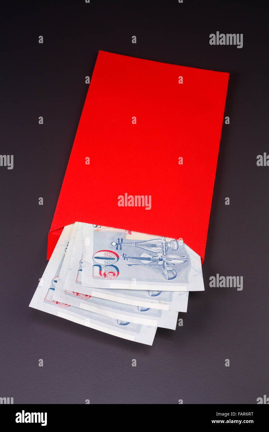 Ang pow with cash isolated on the background Stock Photo - Alamy
